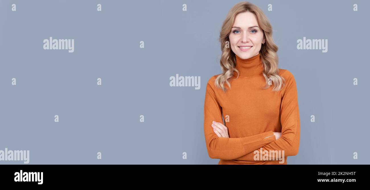 smiling blond woman crossed hands. female beauty and fashion. casual ...