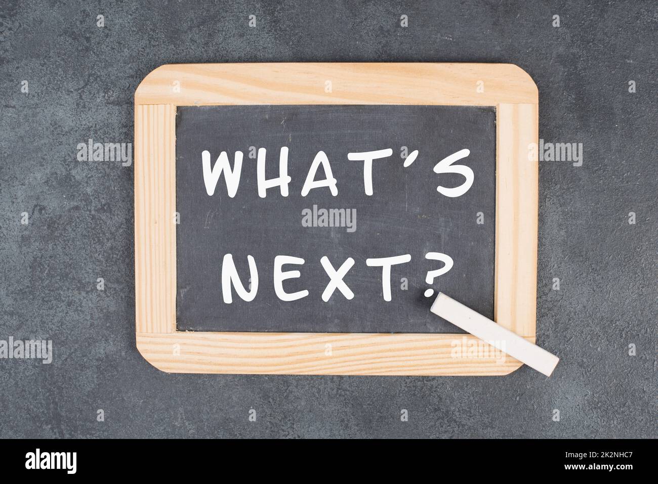 The phrase whatÂ´s next is standing on a chalkboard, having new goals ...