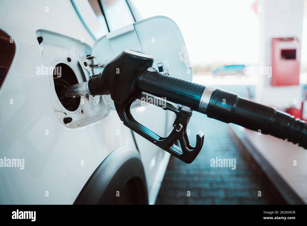 Fuel pump fill a tank of a car in a station Stock Photo - Alamy