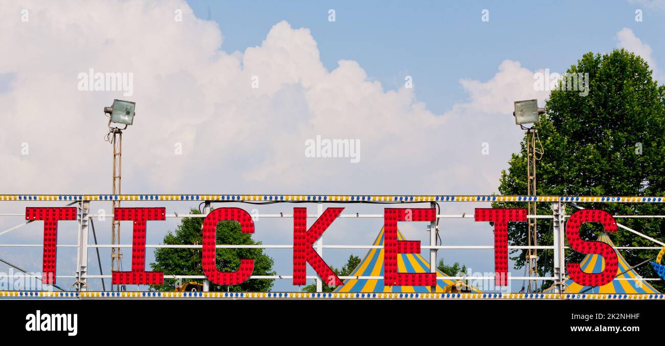 tickets neon sign in the daylight Stock Photo - Alamy
