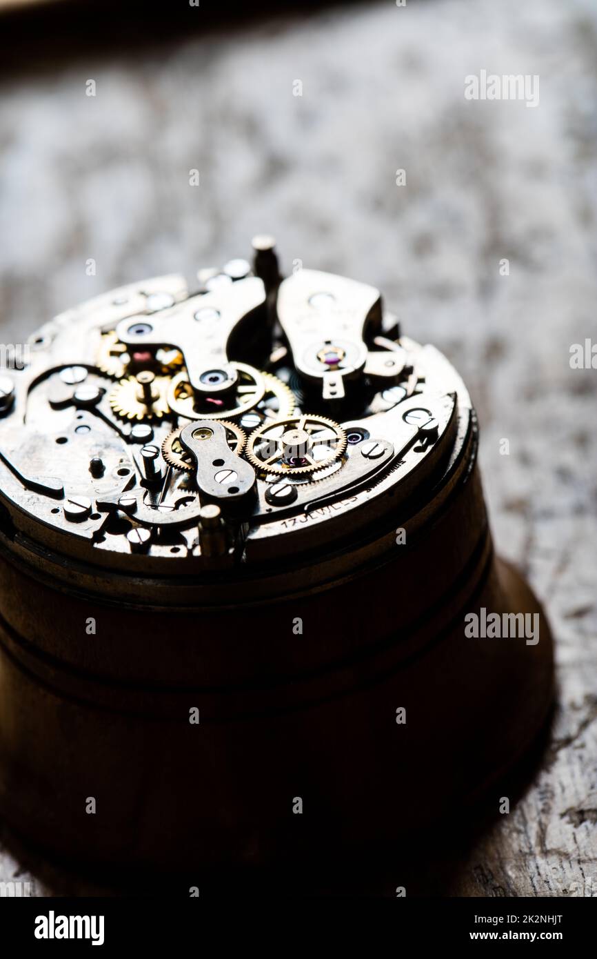fascinating antique watch mechanism on repair table Stock Photo - Alamy