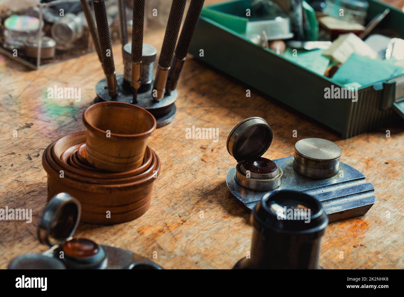Selection of different vintage watchmaking tools on a workbench Stock ...