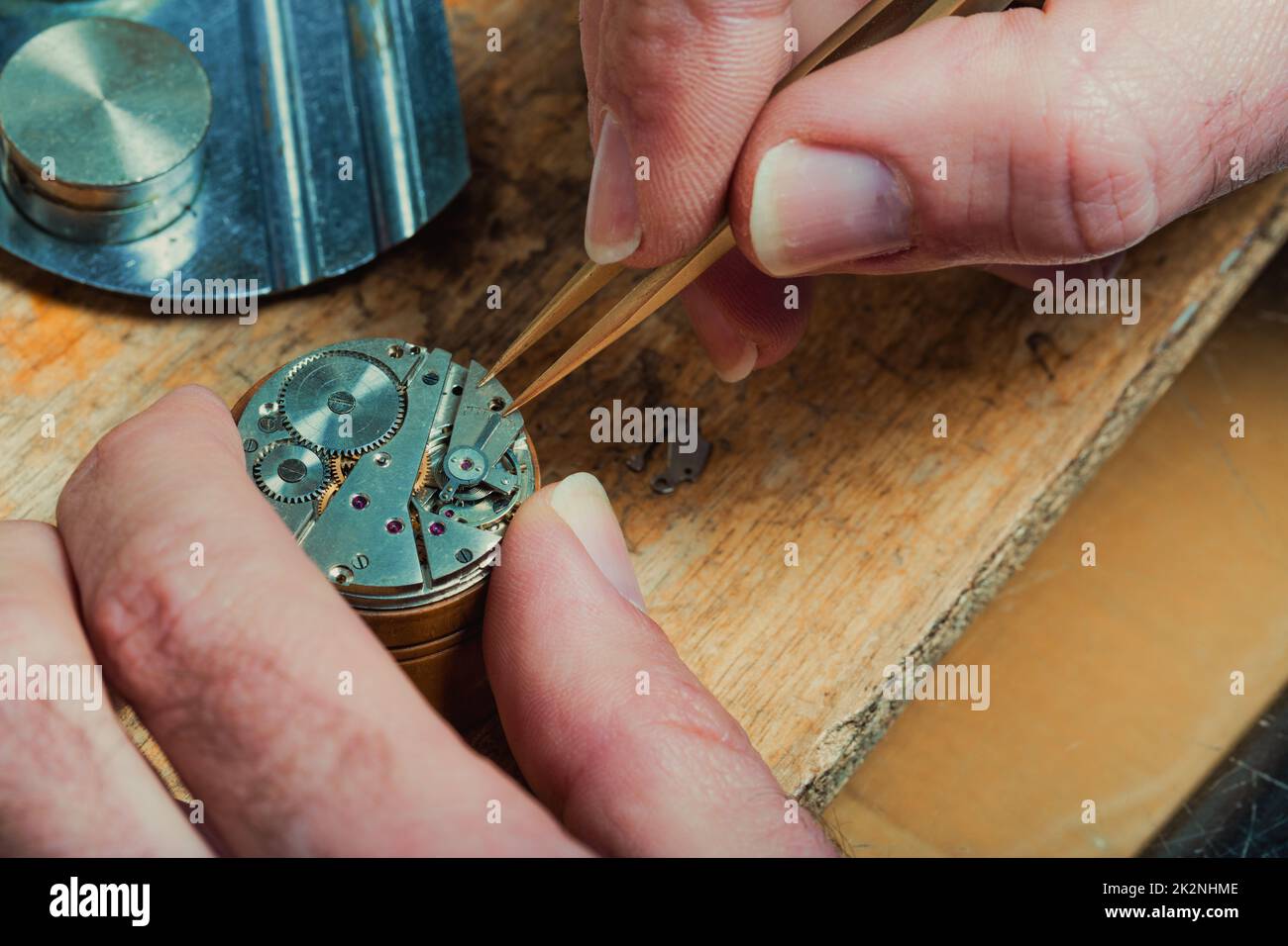 Watchmaker repairing the mechanism of an old watch Stock Photo - Alamy