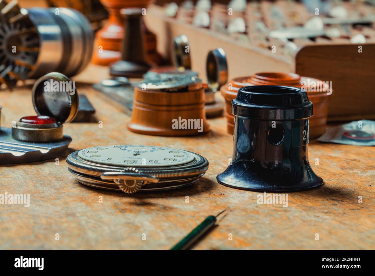 Old Hunter pocket watch and tools on a watchmakers bench Stock Photo ...
