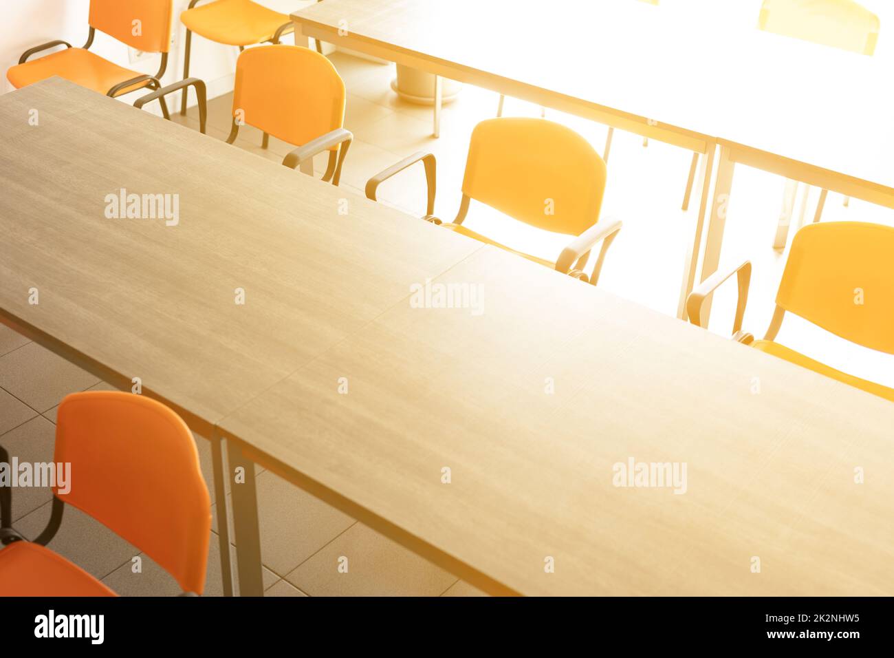 Bright empty conference room with desks and chairs Stock Photo - Alamy