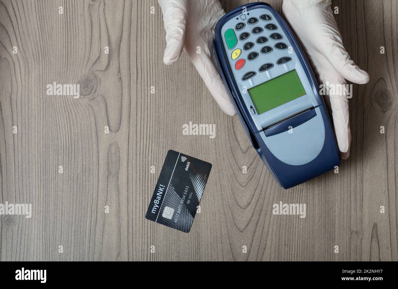 Sales assistant presenting a banking machine Stock Photo - Alamy