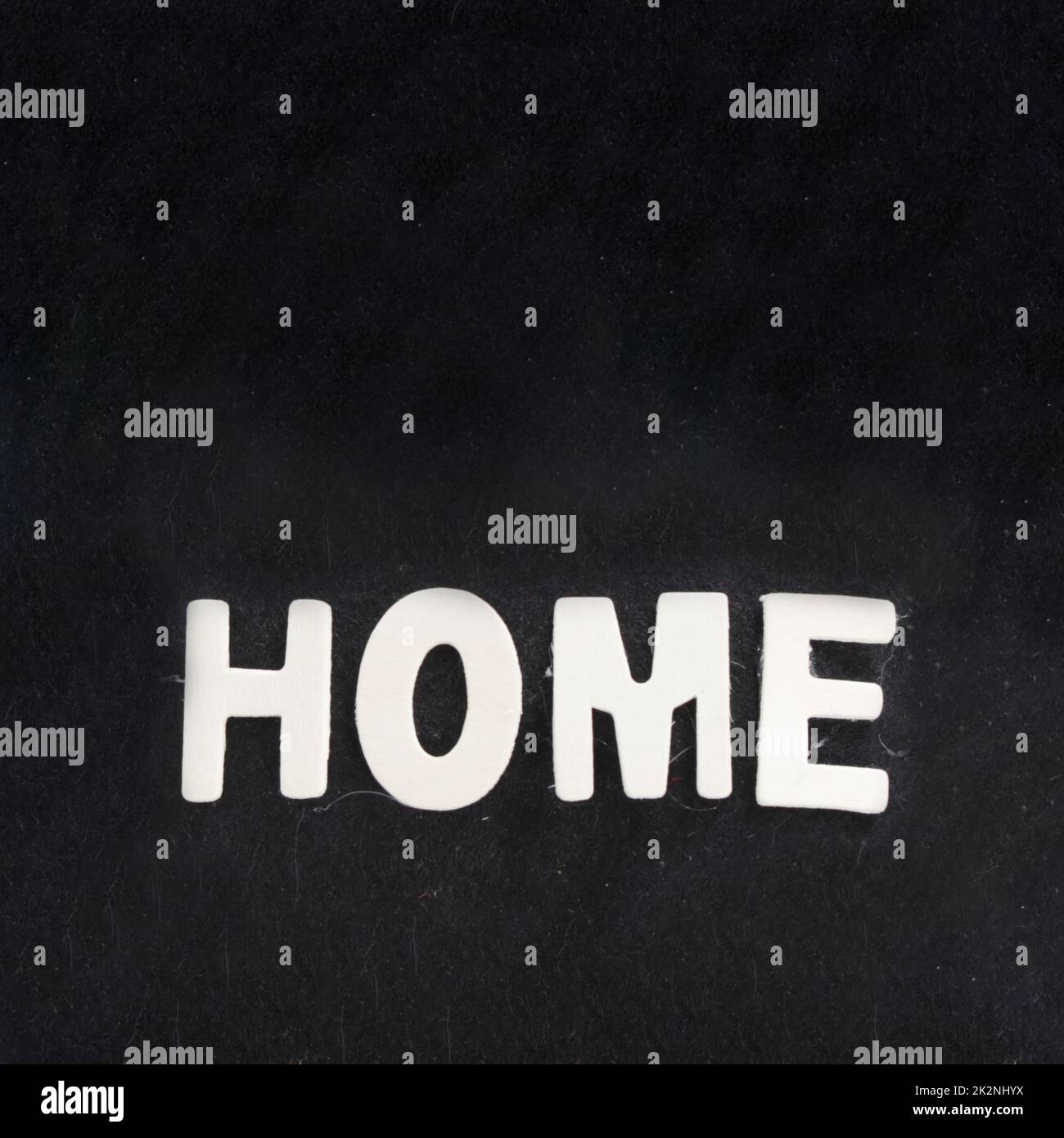 black fabric background with home word in white Stock Photo - Alamy