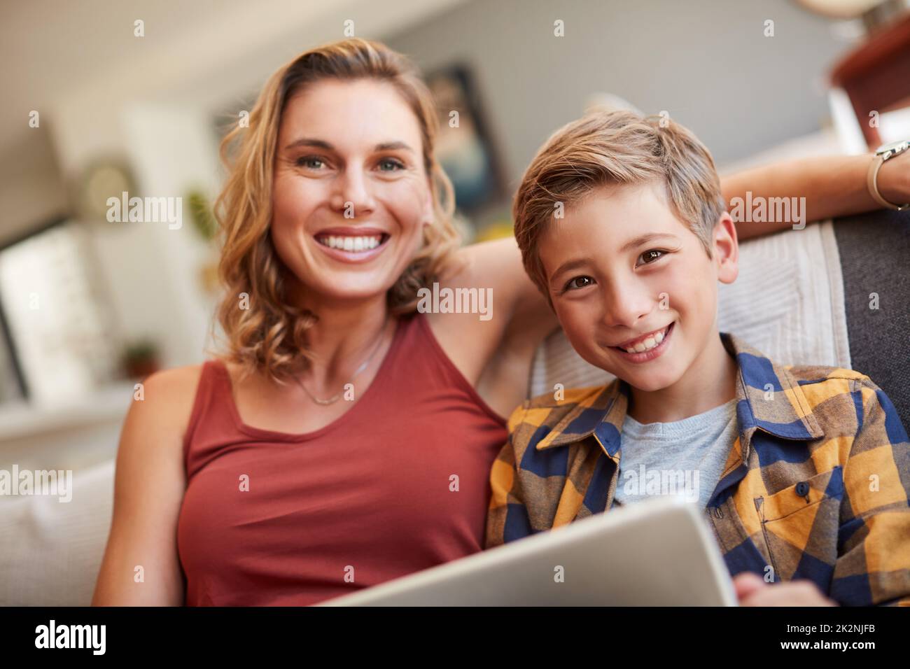 Boy family caucasian sofa tablet hi-res stock photography and images - Alamy