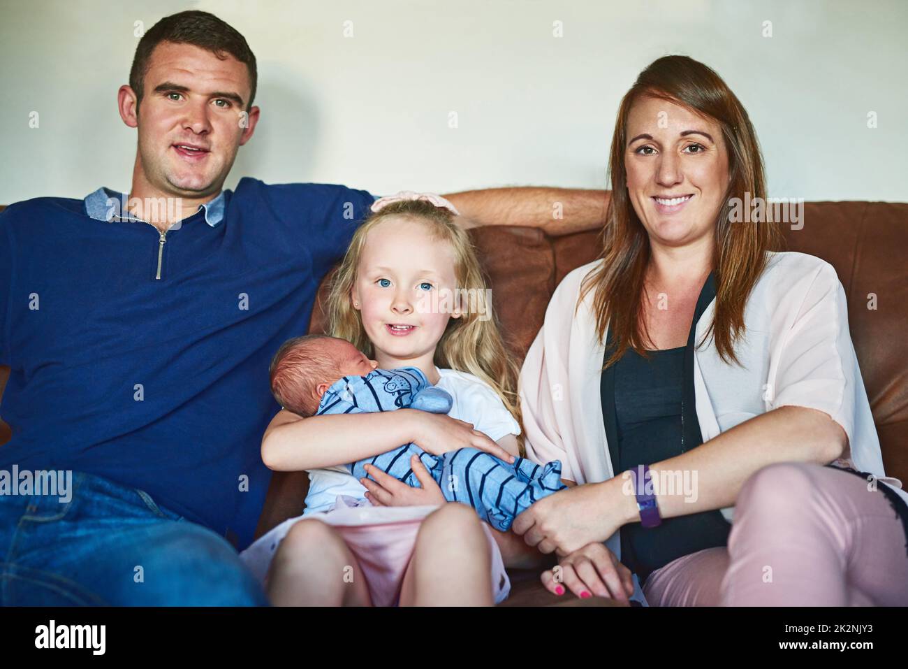 We spend our weekends together. Portrait of a cheerful young family ...