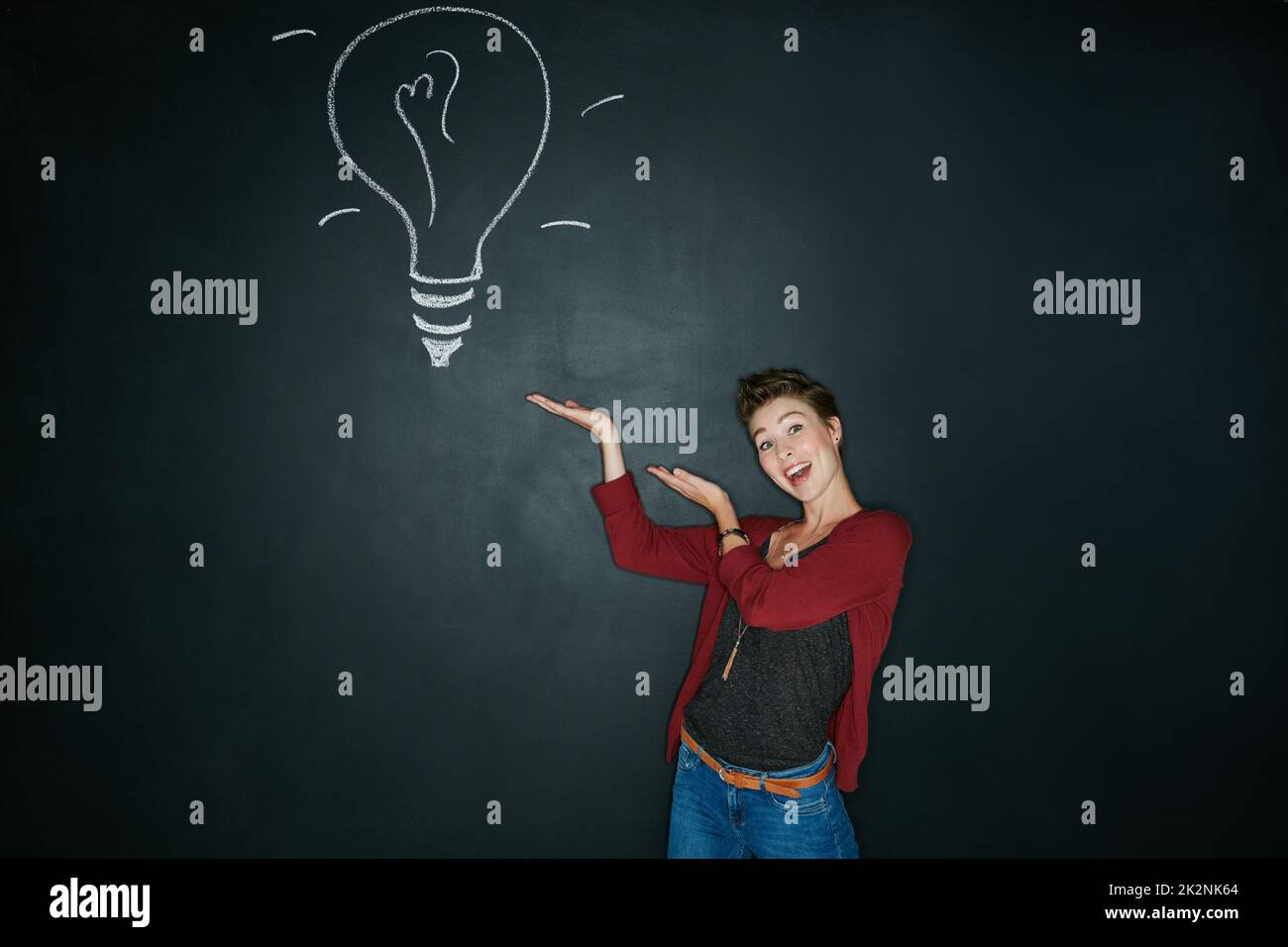 Presenting the solution to your problem. Studio shot of a young woman ...