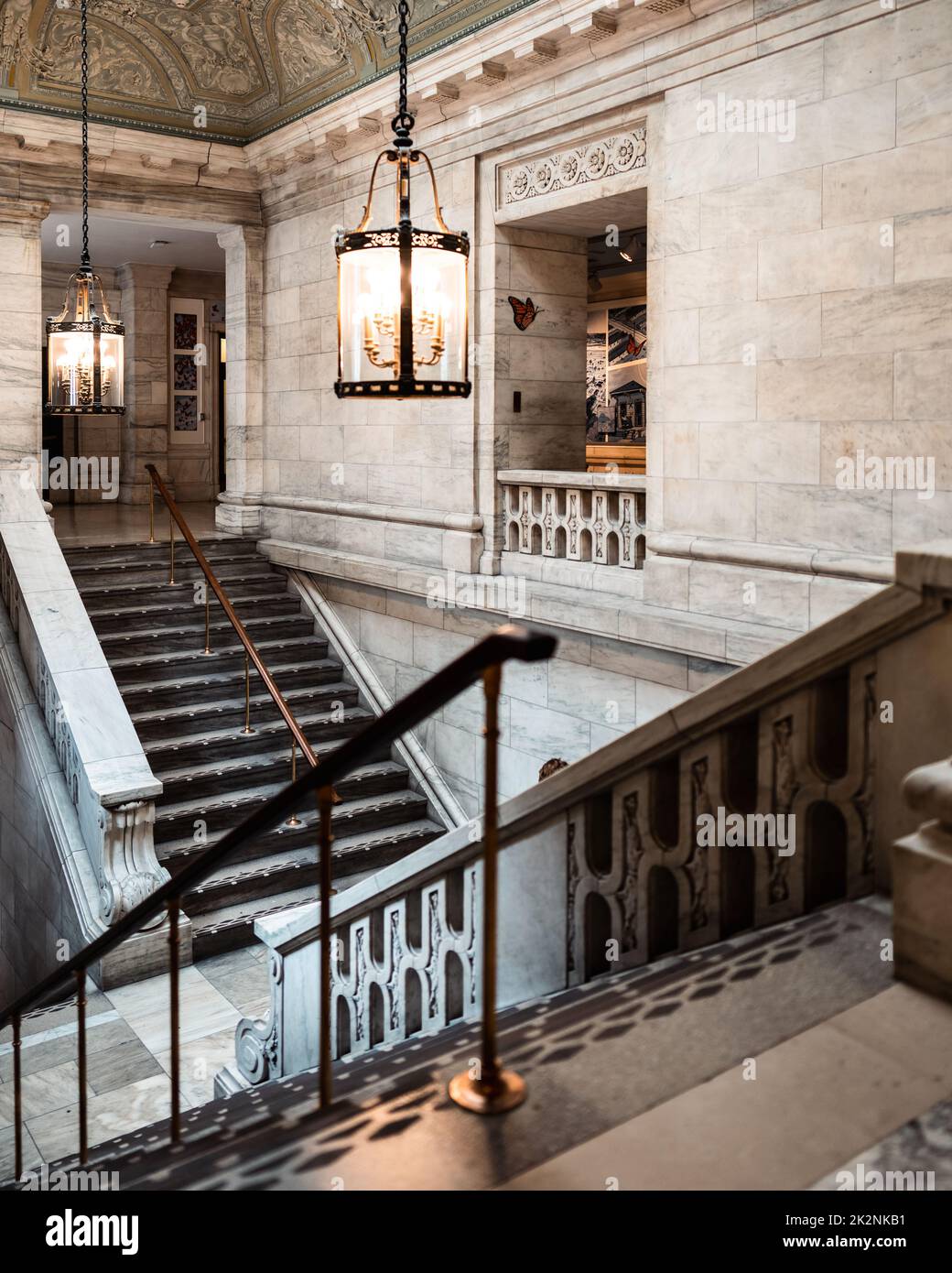 A vertical shot of an interior of a museum with stairs and beautiful ...