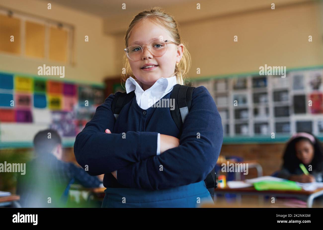 Child standing in classroom hi-res stock photography and images - Alamy