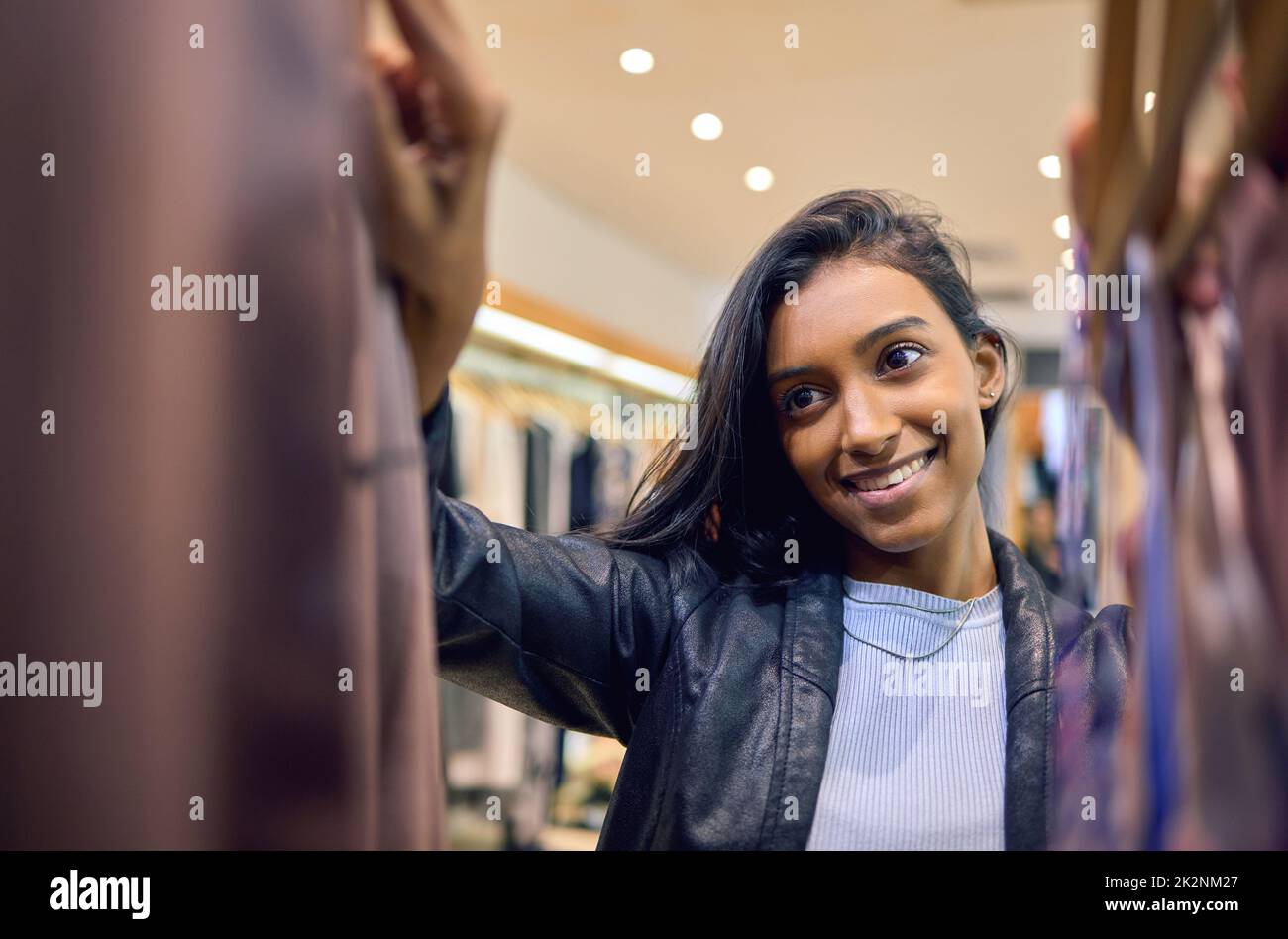 Woman looking through the rails hi-res stock photography and images - Alamy