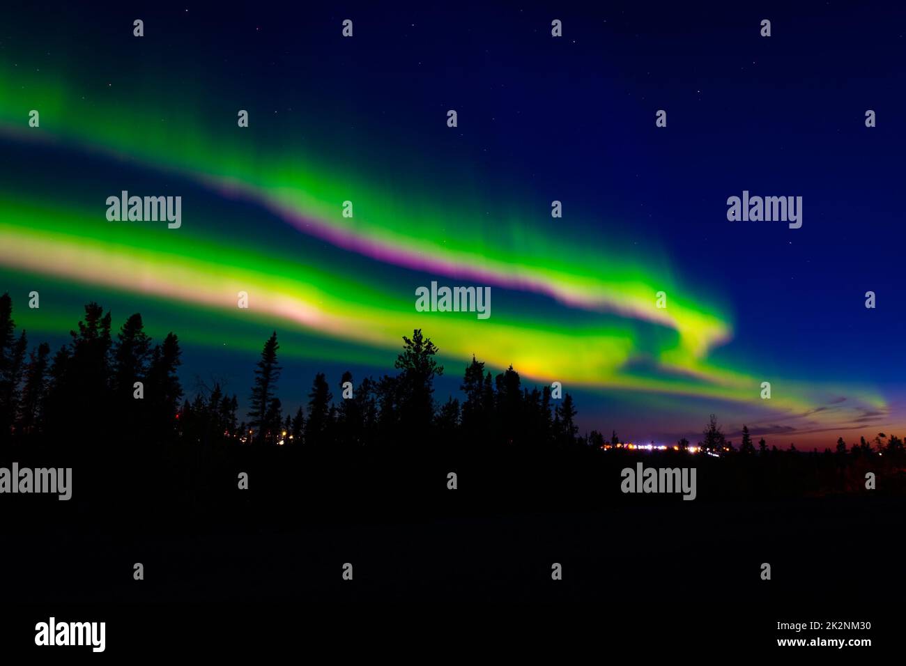A green neon Aurora Borealis in the sky Stock Photo - Alamy