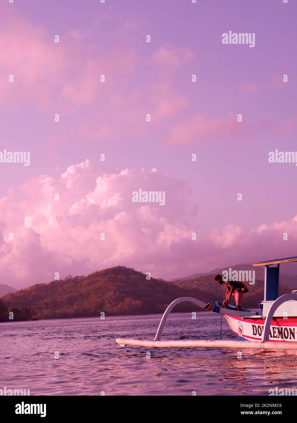 An aerial view of fisherman lifting anchor in sea Stock Photo - Alamy