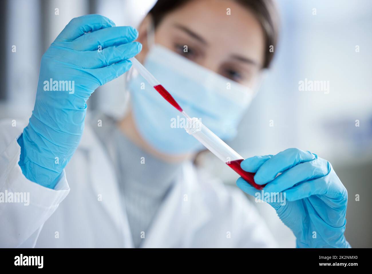 Doing multiple tests to confirm the results. Closeup shot of a young ...