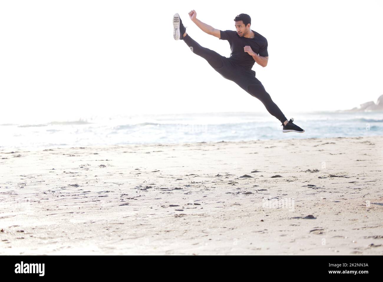 Kicking it into high gear. Full length shot of a handsome young male ...