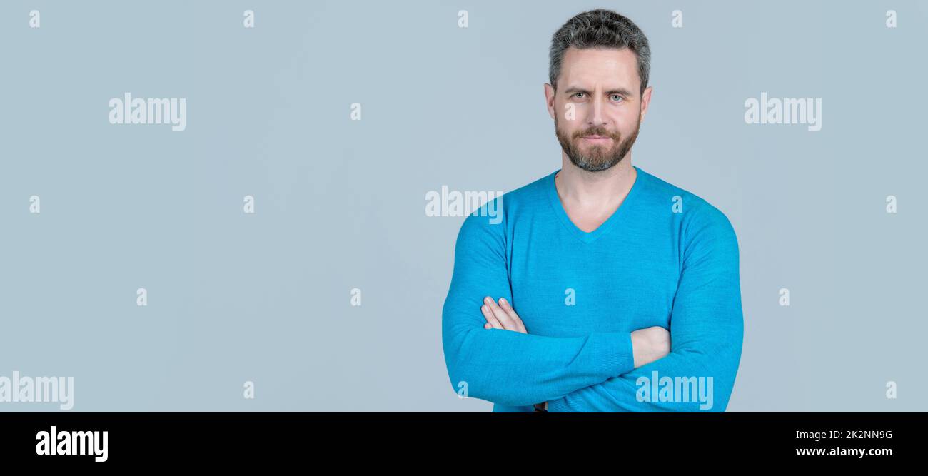 Man face portrait, banner with copy space. handsome man in casual wear has grizzled hair ...