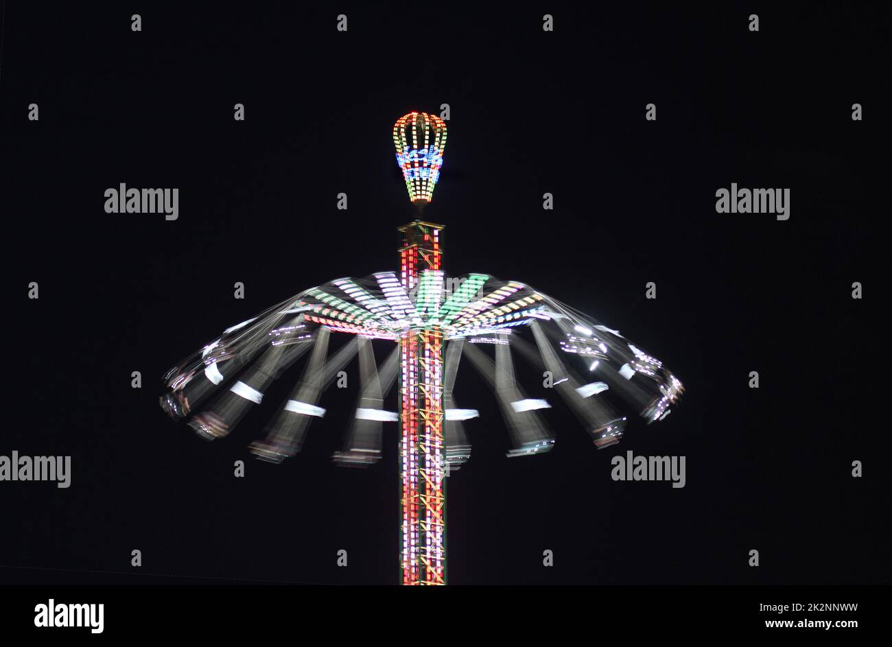 Flying carousel by night, blurred motion. Merry go round on october ...