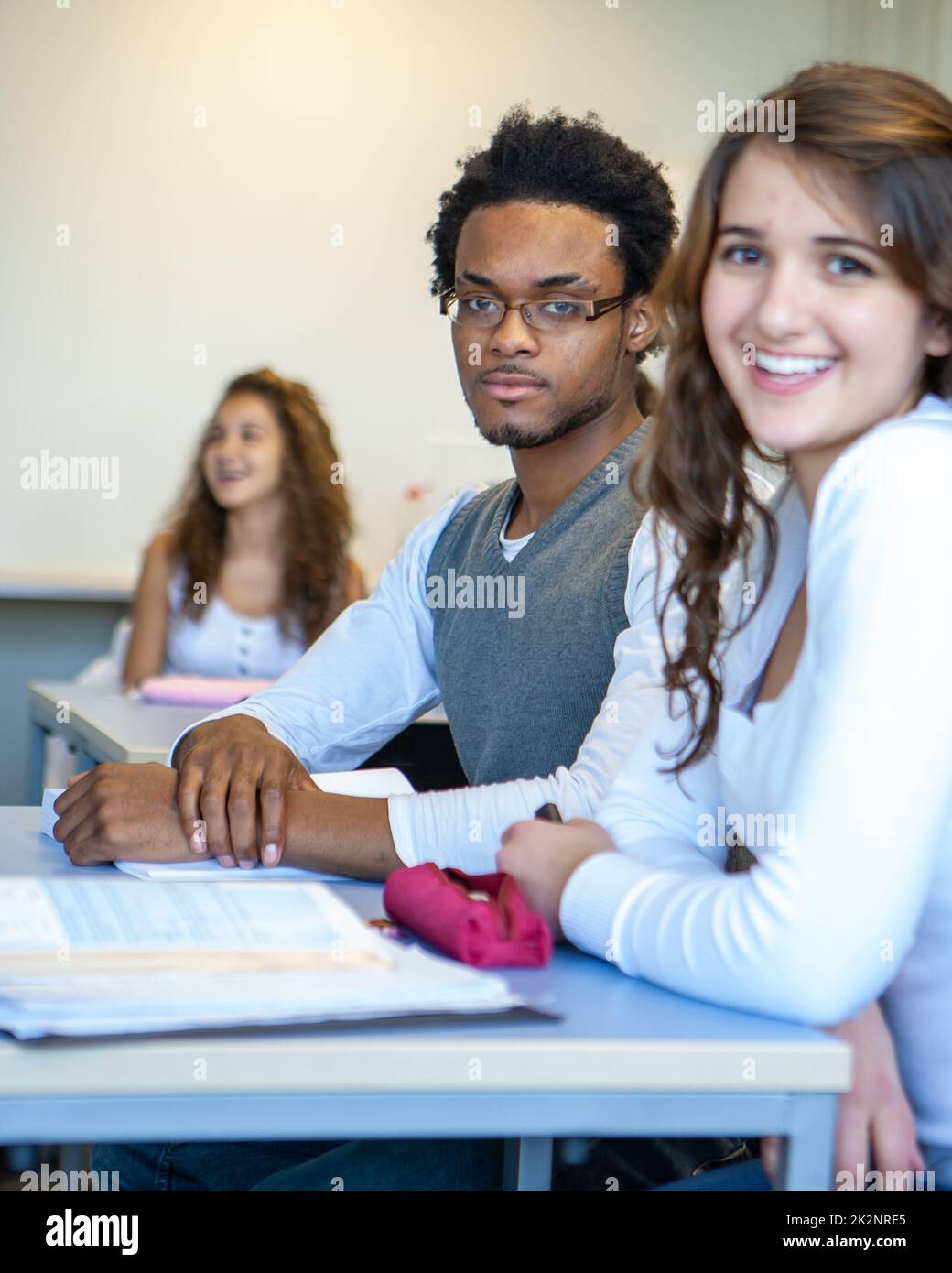 Teenage Students: Classmates. Late teenage pupils with bright smiles at ...