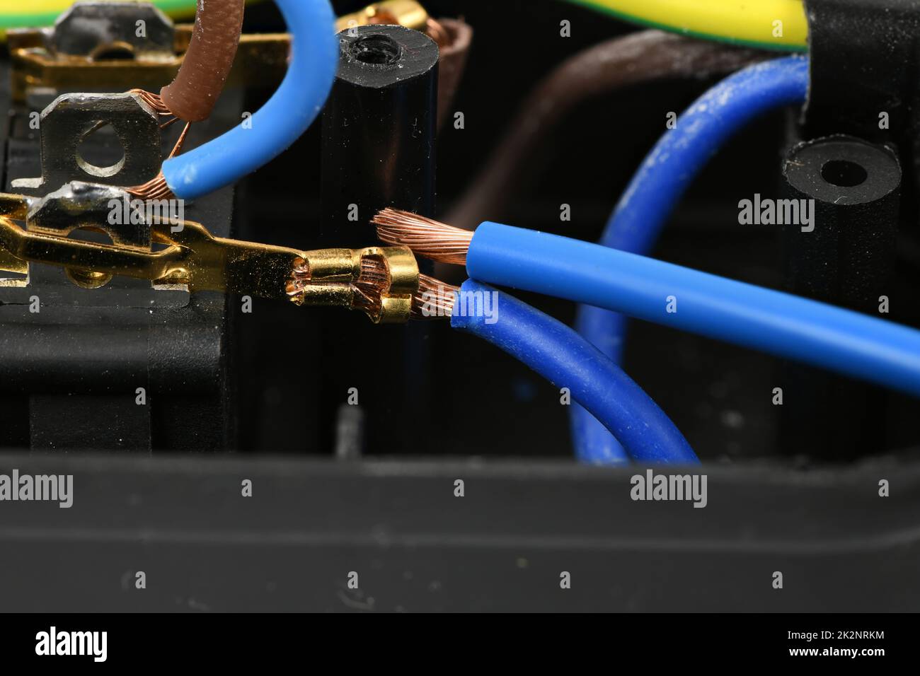 Internal device of a black plastic electrical extension cord for ...