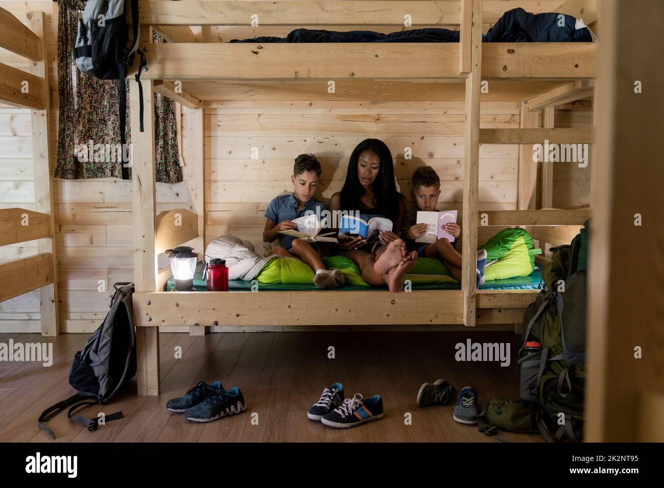 Woman reading book in bed cosy hi-res stock photography and images - Alamy