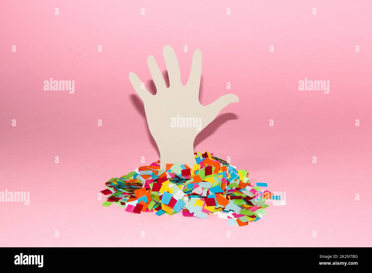 zombie hand comes out of colorful ground, creative halloween concept ...
