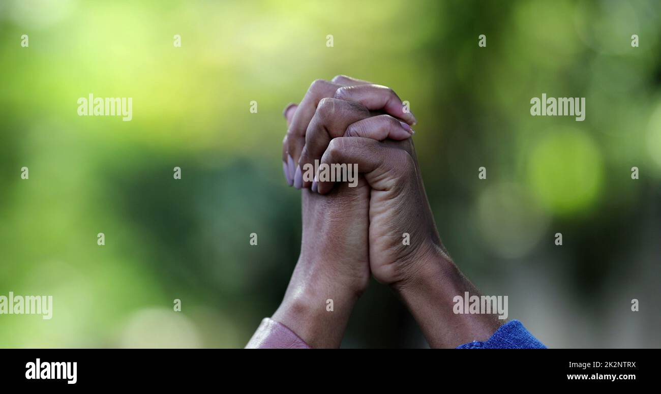 Two People joining hands together in union and teamwork Stock Photo - Alamy