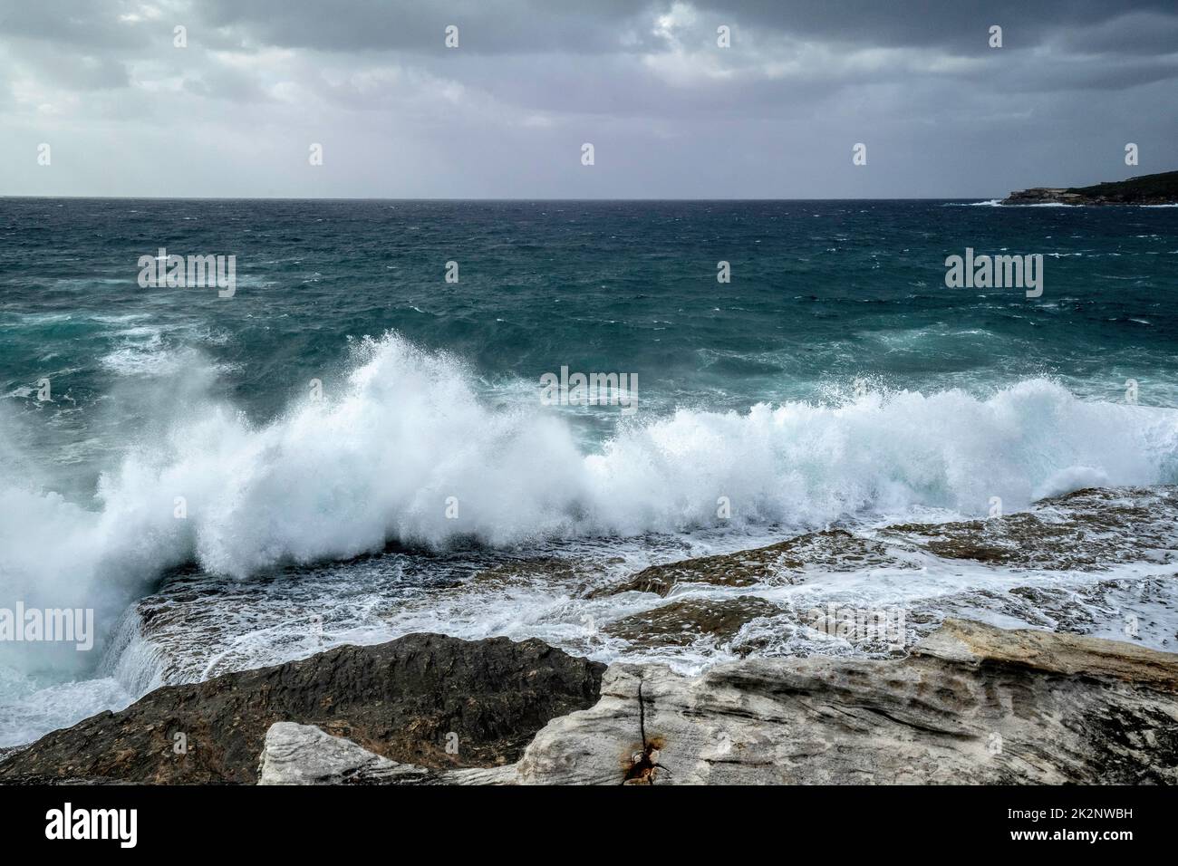 An aerial view of stormy waves splashing against a seashore Stock Photo ...