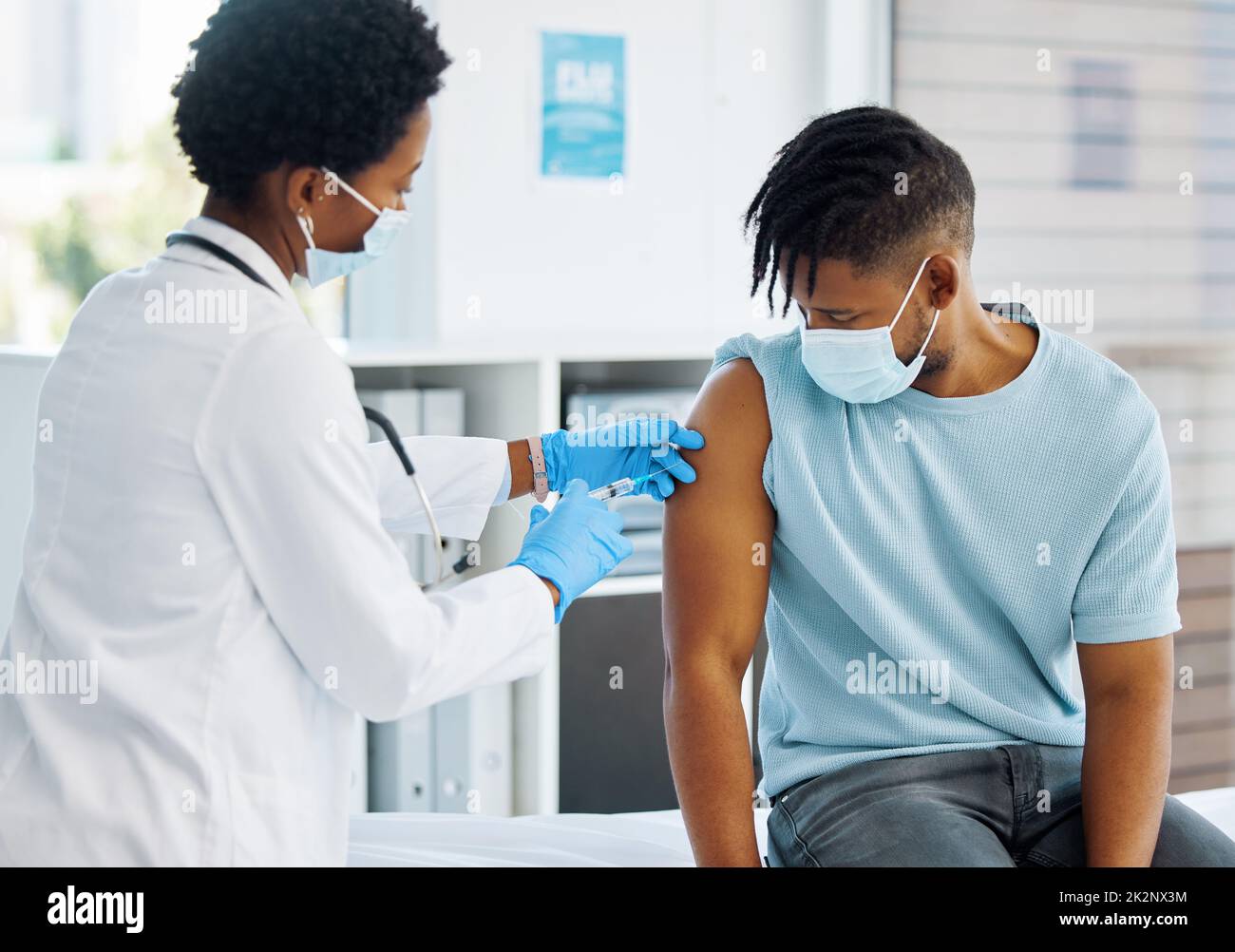 This vaccine will kick in soon. Shot of a doctor giving her patient an ...