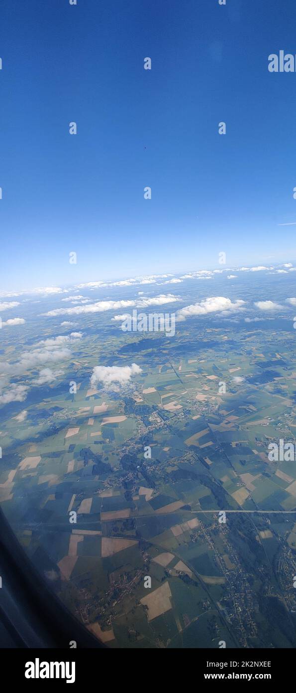 An aerial view from airplane of a countryside with farmlands and ...