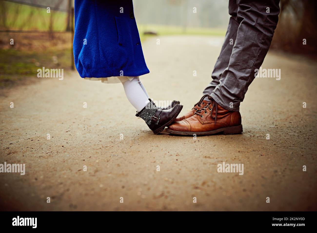 Small feet, big feet, how very sweet. Shot of an unrecognizable father ...