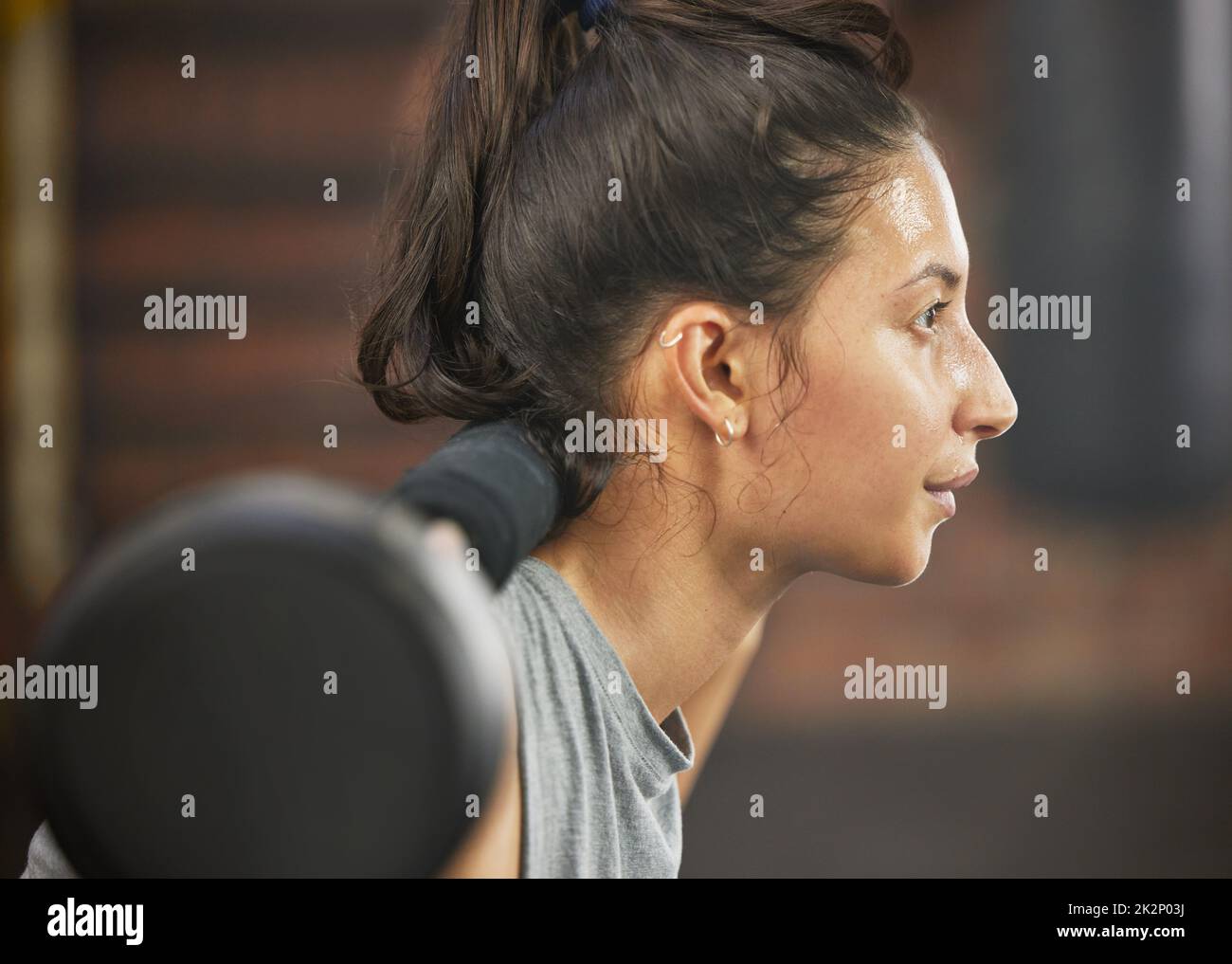 I am strong and powerful. Shot of a sporty young woman exercising with ...