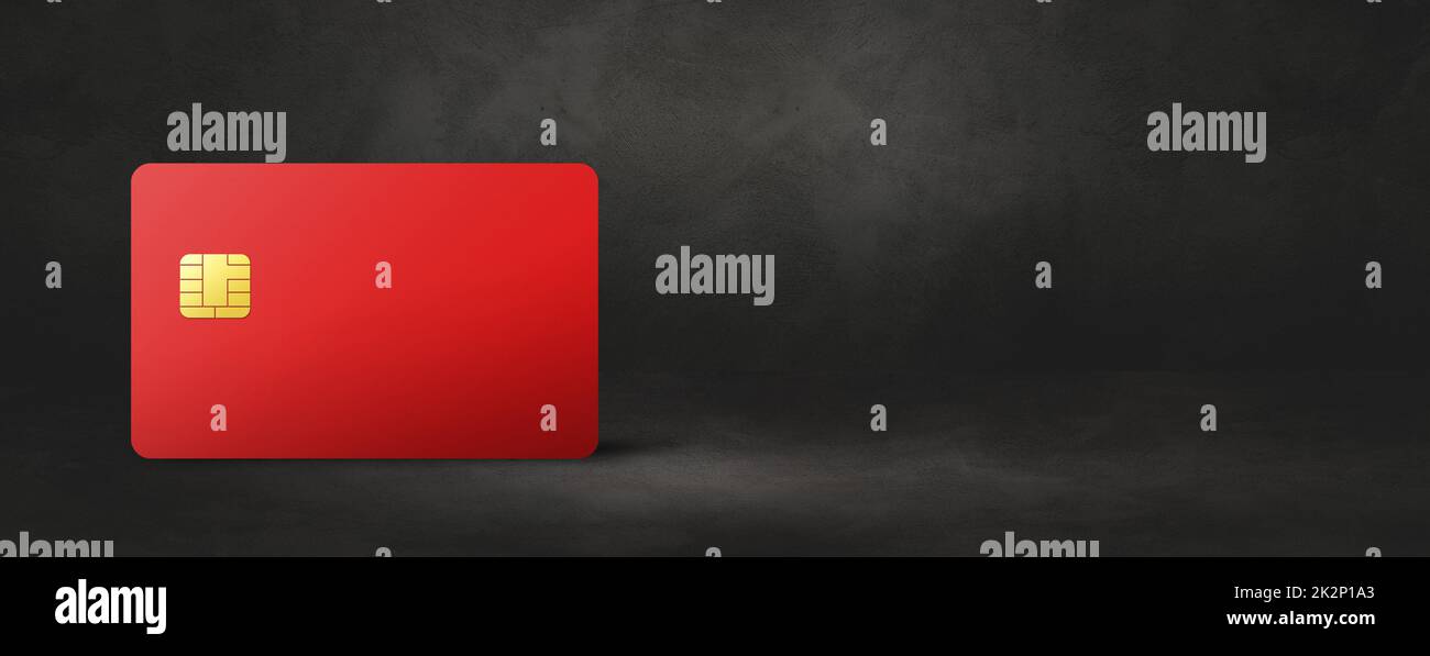 Red credit card on a black concrete background Stock Photo - Alamy