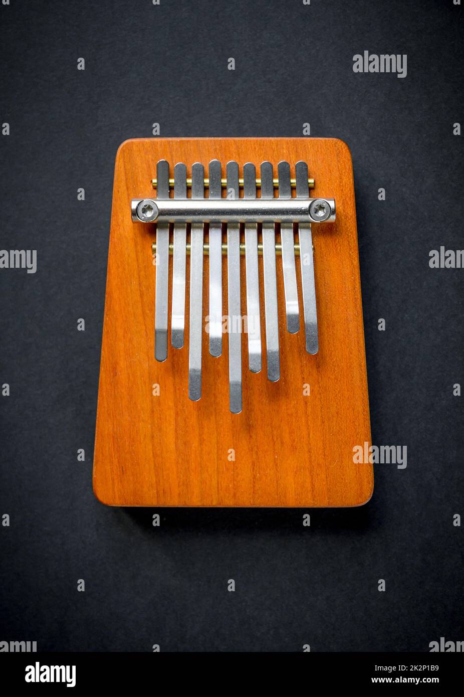 Traditional wooden kalimba isolated on black Stock Photo - Alamy