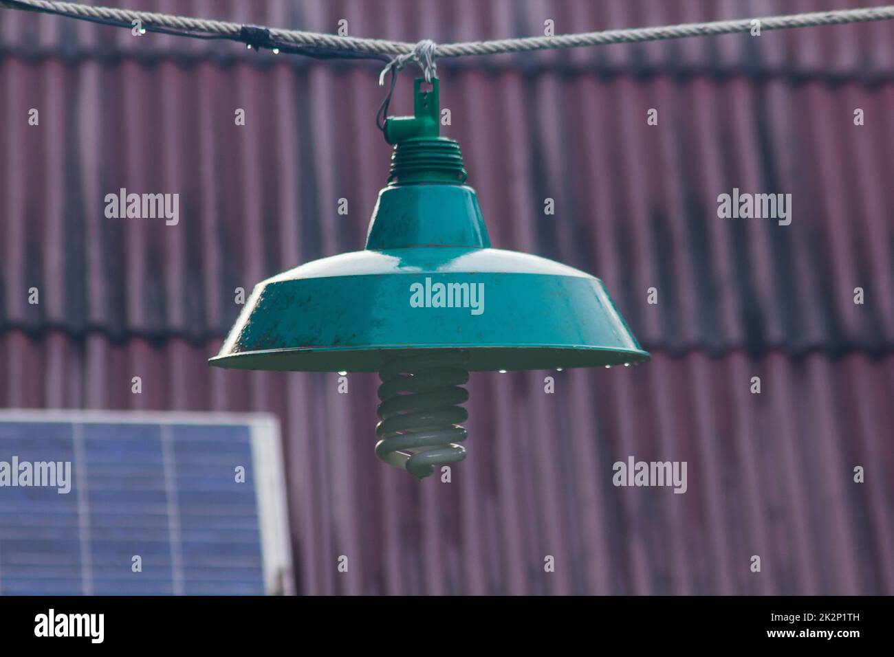 Old green lanterns hung with ropes and wet with rain Stock Photo - Alamy