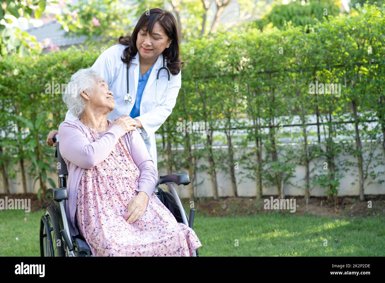Doctor help and care Asian senior or elderly old lady woman patient sitting on wheelchair at ...