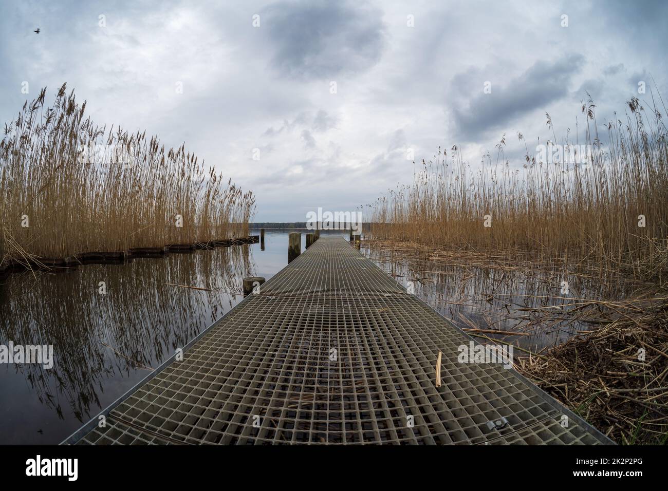 Small empty dock for boats on the lake Stock Photo - Alamy