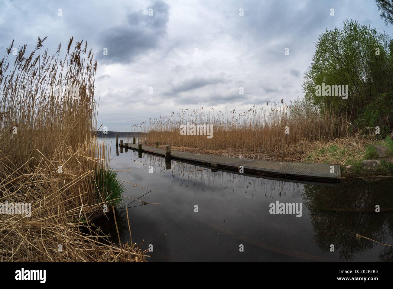 Small empty dock for boats on the lake Stock Photo - Alamy