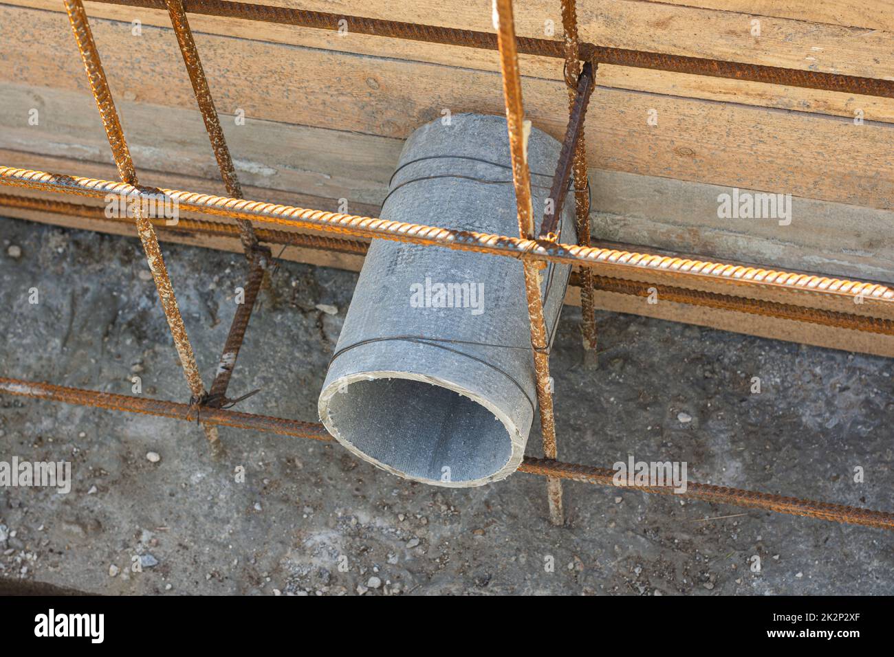 Construction of a strip foundation, laying a sleeve for communications ...