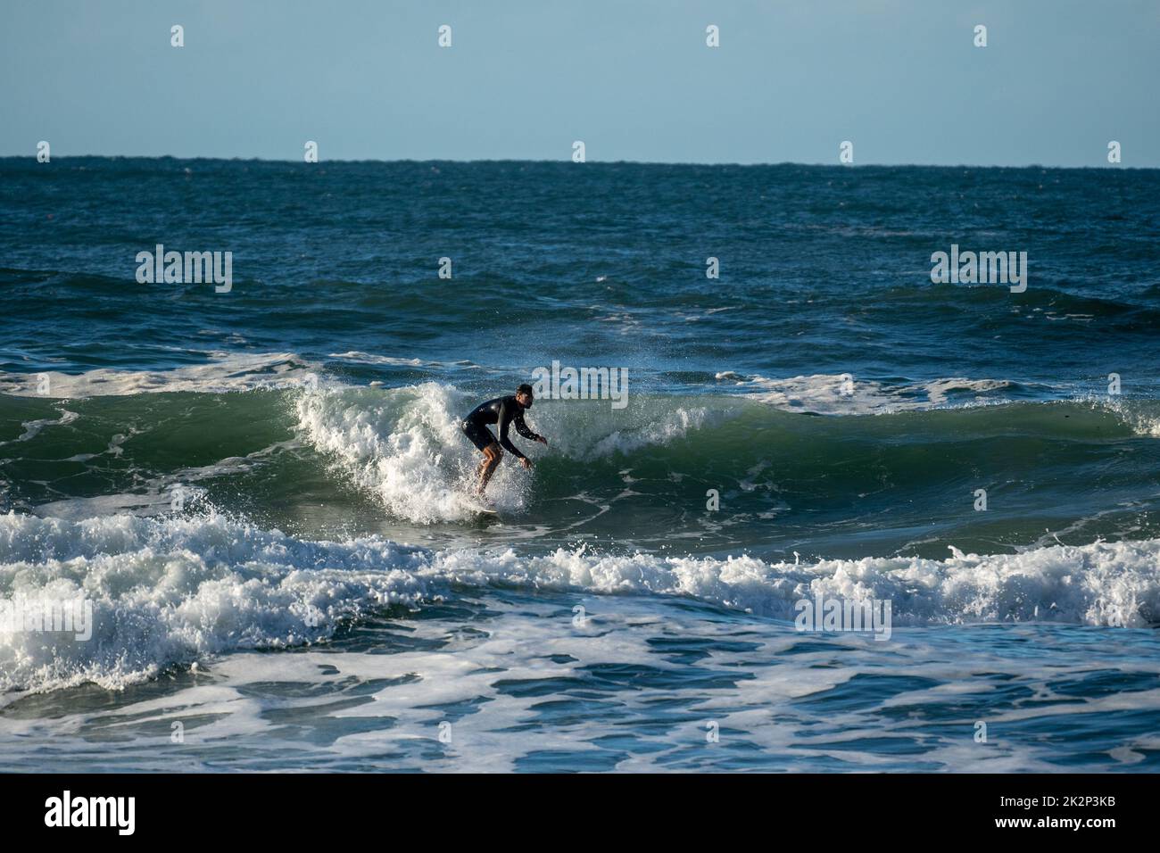 A surfer at Bondi Beach, Australia, on Saturday morning having fun and ...