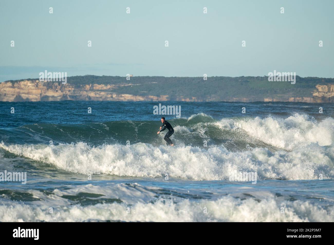 A surfer at Bondi Beach, Australia, on Saturday morning having fun and ...