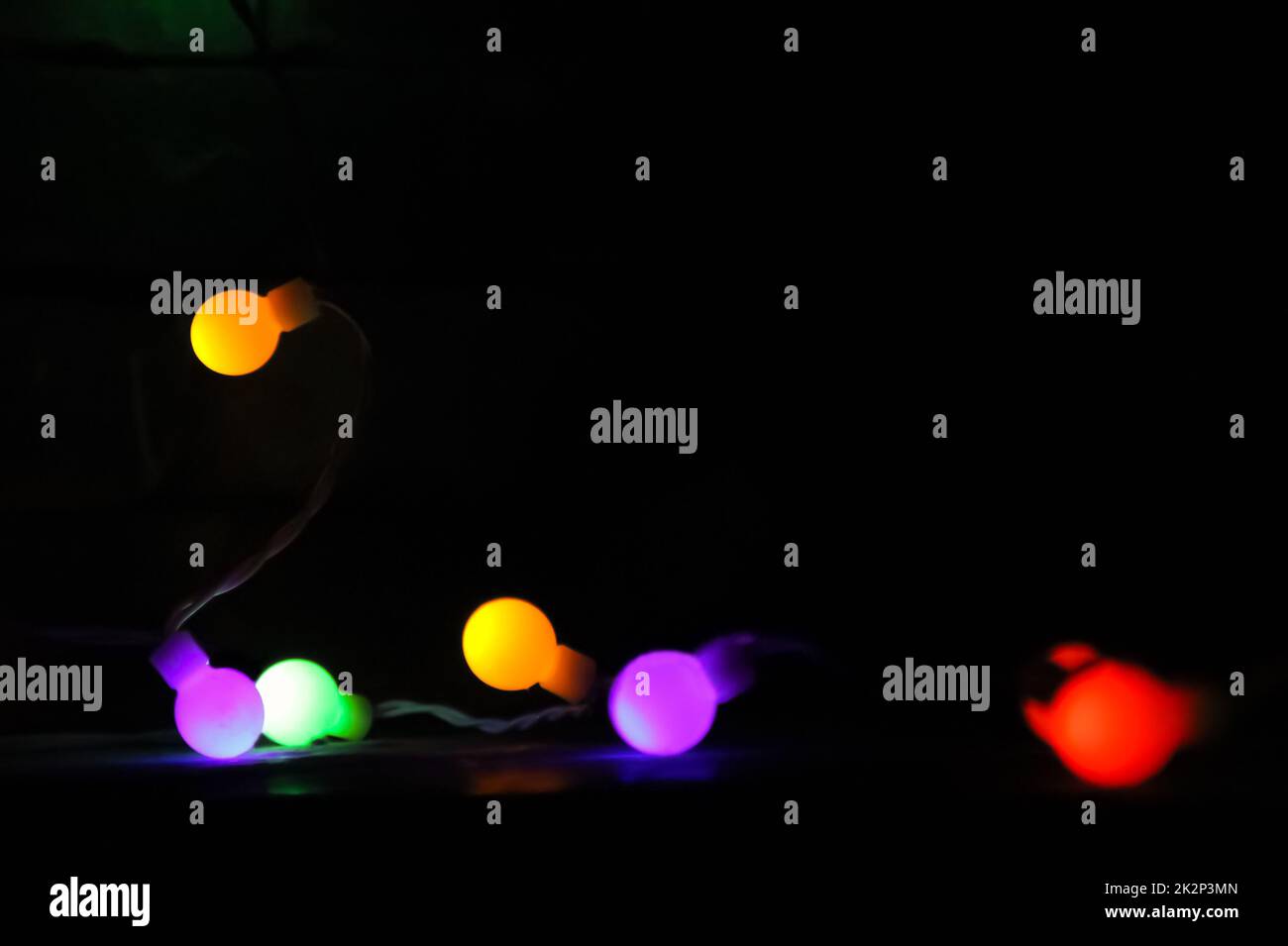 bright colored lights in a show with black background. Show with ...