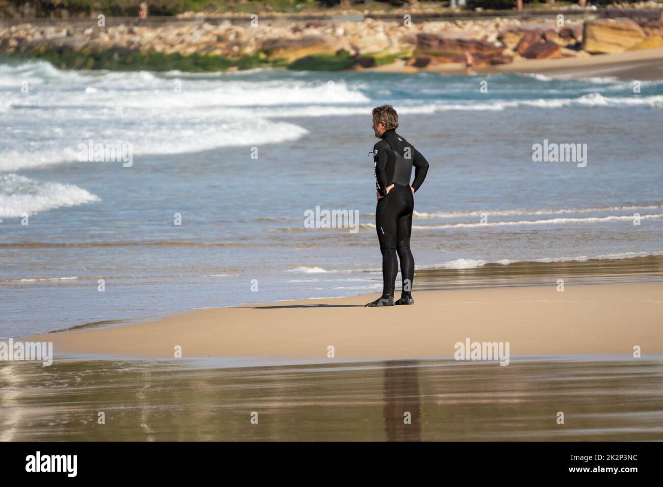 A lifeguard looking at the ocean, getting ready for rescue in Bondi ...