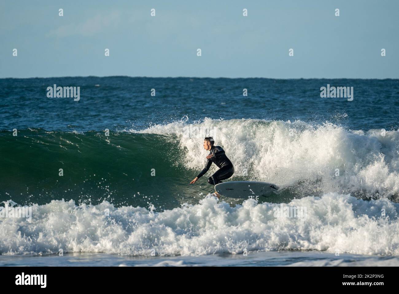 A surfer at Bondi Beach, Australia, on Saturday morning having fun and ...