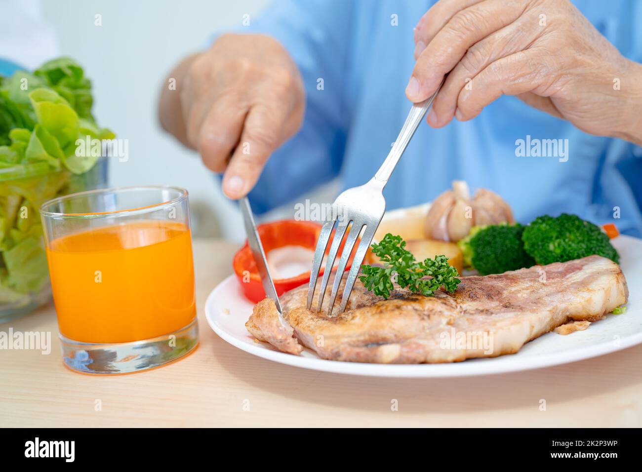 Man eating on hospital bed hi-res stock photography and images - Alamy