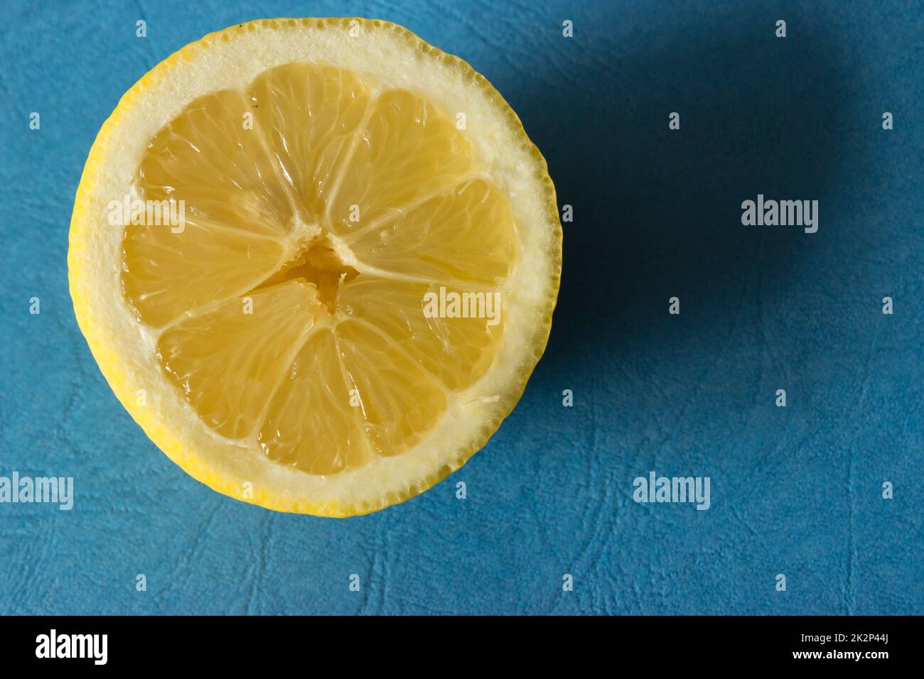 Lemon cut in half Stock Photo - Alamy