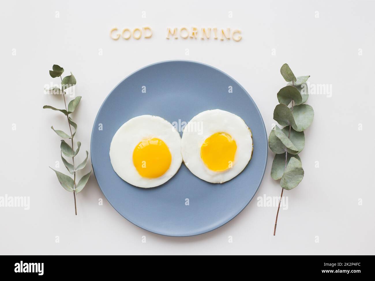 two beautiful eggs on a plate Stock Photo - Alamy