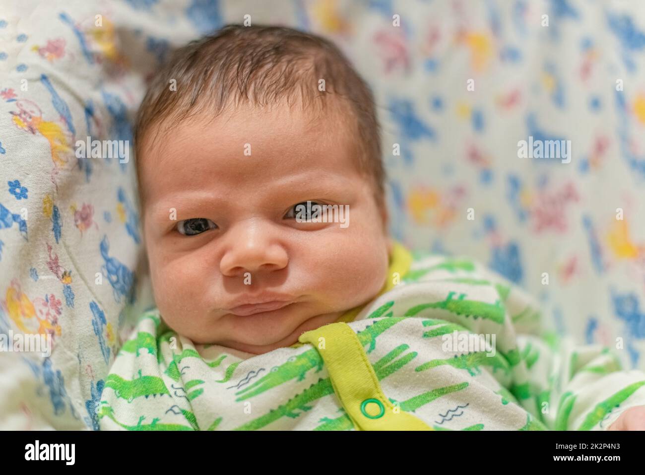 Portrait of baby girl lying on bed hi-res stock photography and images ...