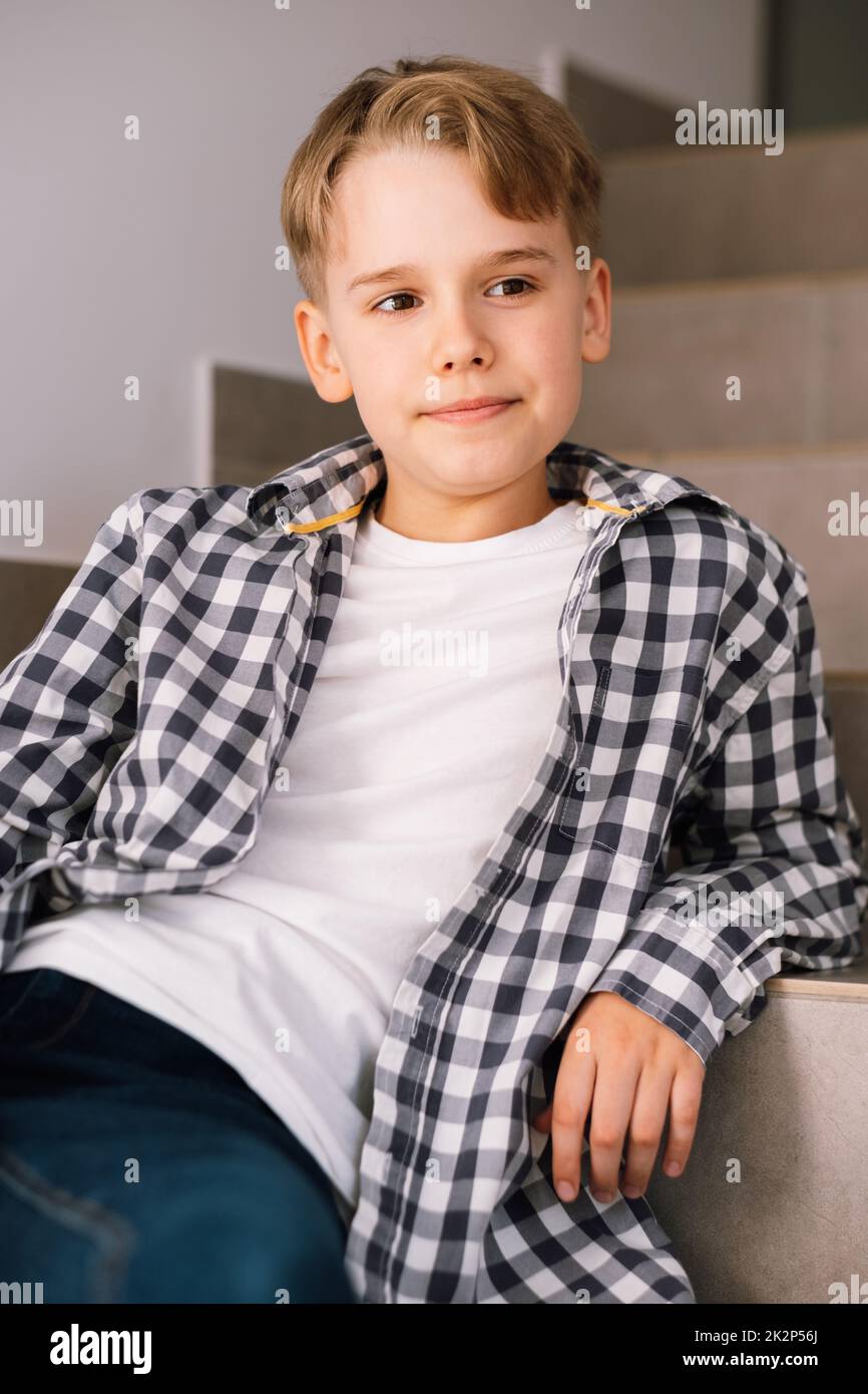 Stylish teenager guy smiling while posing for a beautiful photo while ...